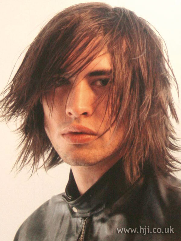 Natural texture brunette men's hairstyle with a fringe