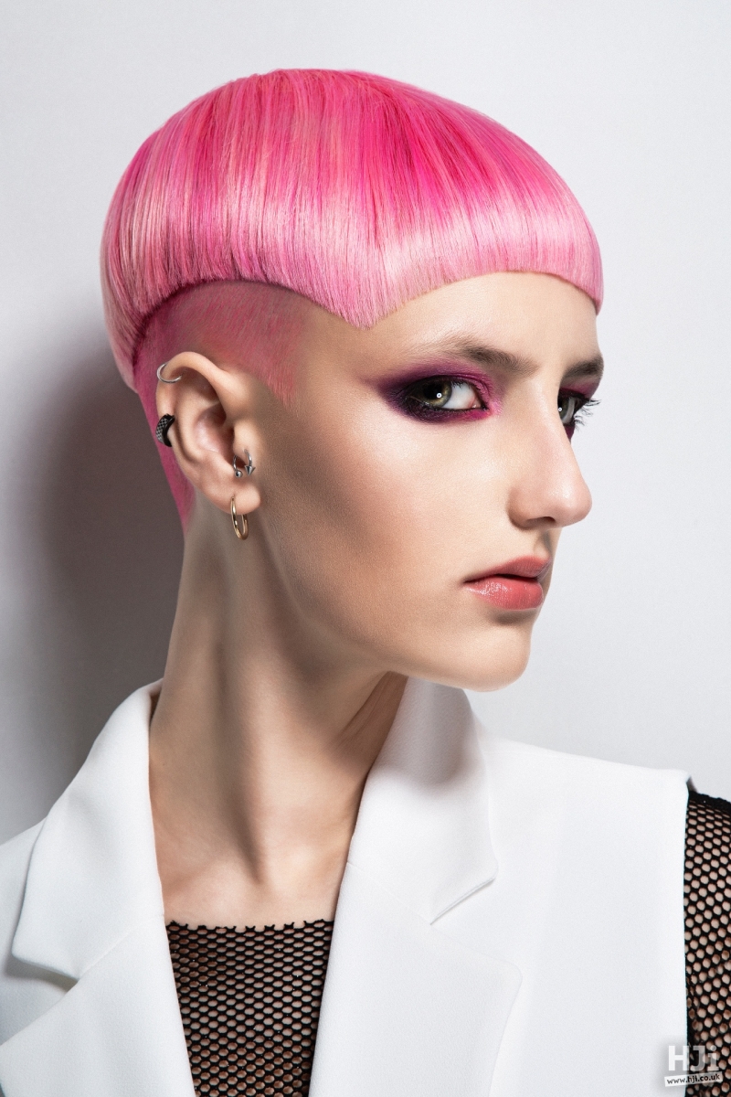 Geometric bright pink pixie cut with shaved sides